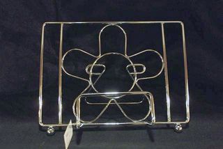 Leggio in metallo cromato, Viceversa.