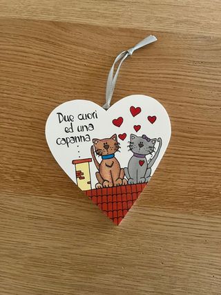 Quadretto a forma di cuore con gatti