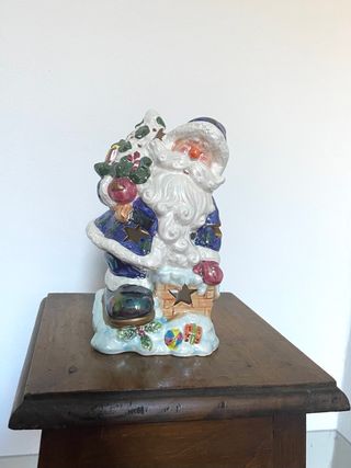 Babbo Natale porta candela 