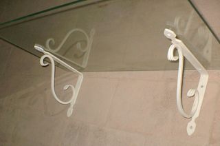 Coppia reggimensole avorio ferro battuto