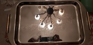 vassoi in acciaio con disegno intarsiato