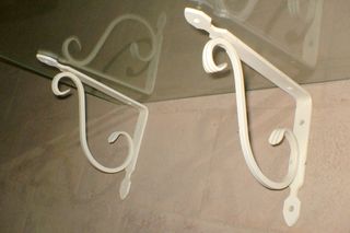 Coppia reggimensole avorio ferro battuto