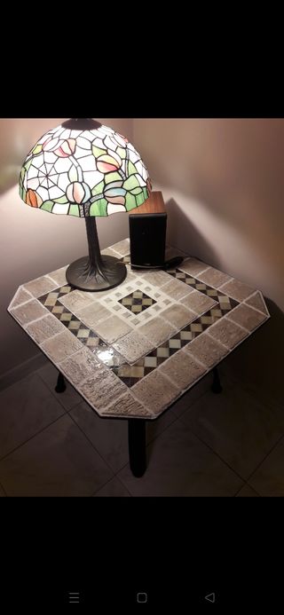 tavolino in ferro battuto con inserti in travertin