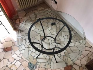 Tavolo in cristallo e ferro battuto