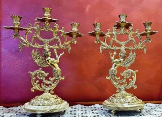 coppia di candelabri a 3 fiamme con angeli putti 