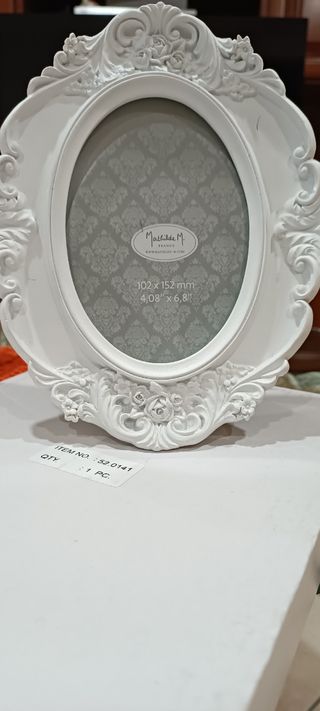 cornice ovale bianca 