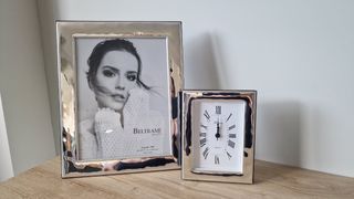 Cornice portafoto + orologio beltrami
