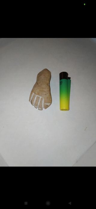 scultura in pietra piede