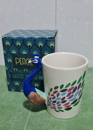 Tazza in ceramica a forma di pavone nuova