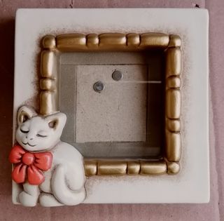 cornice piccola con gattino Thun