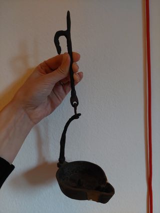 Antico porta candela in ferro