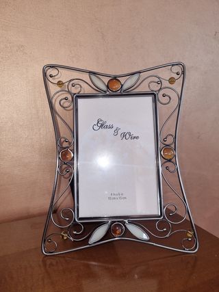 cornice acciaio e perle