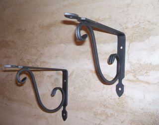 Coppia reggimensole ferro battuto