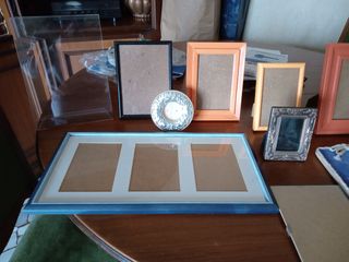 11 portafoto e un quadretto 