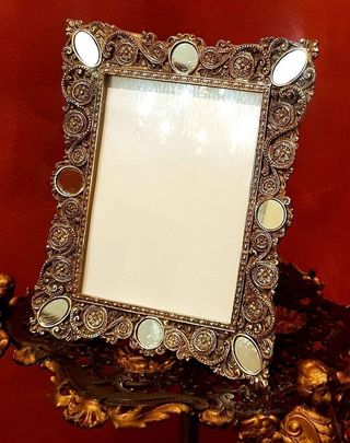 cornice portafoto con specchi inglobati