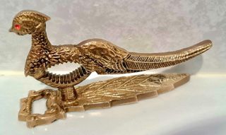  singolare schiaccianoci ed apribottiglie bronzo