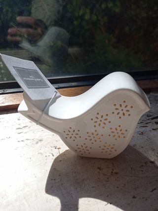 uccellino in ceramica che si illumina
