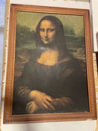 Riproduzione della Gioconda in cornice lavorata