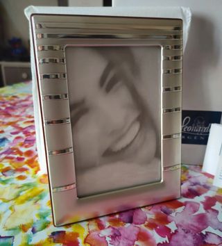 cornice in argento e legno