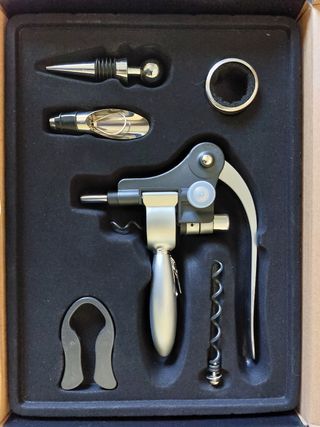 kit vino - cavatappi e salva goccia vino