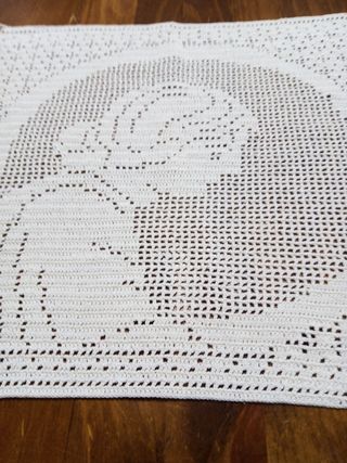 Uncinetto a mano con volto