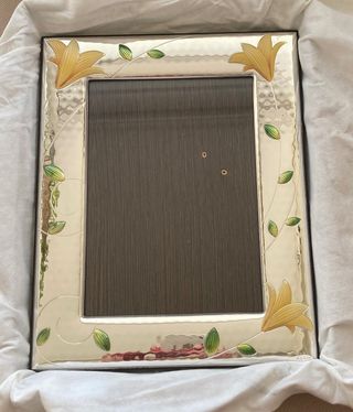 Cornice in argento nuova