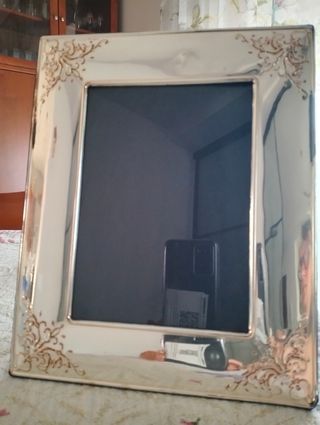 Cornice in argento