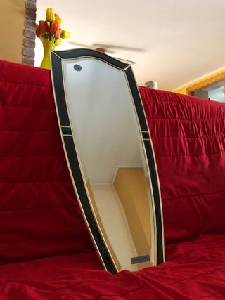 Specchio antichizzato rilegato in ottone