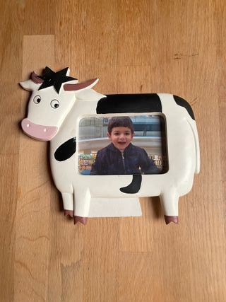 Cornice a forma di mucca