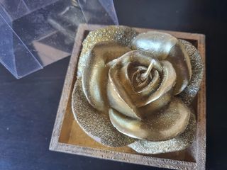 Candela rosa dorata con scatolina