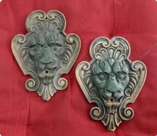 Coppia di mascheroni volto di leone cm 13x17