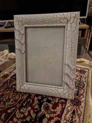 Cornice con inserti  in argento
