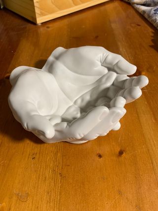 svuotatasche a forma di mani