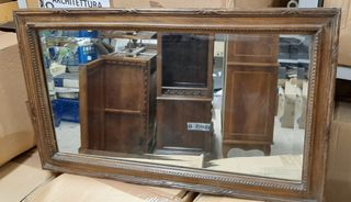 Specchio scolpito in legno e stucco