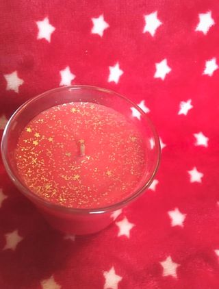 candela rossa con stelle oro Nuova
