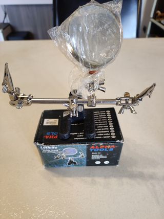 Mani di supporto con lente