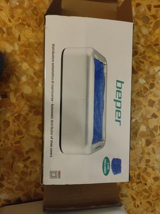 distributore automatico copripiedi