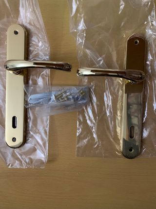 Coppia maniglia con placca per porta interna oro