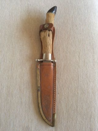 coltello con manico di zampa di cervo